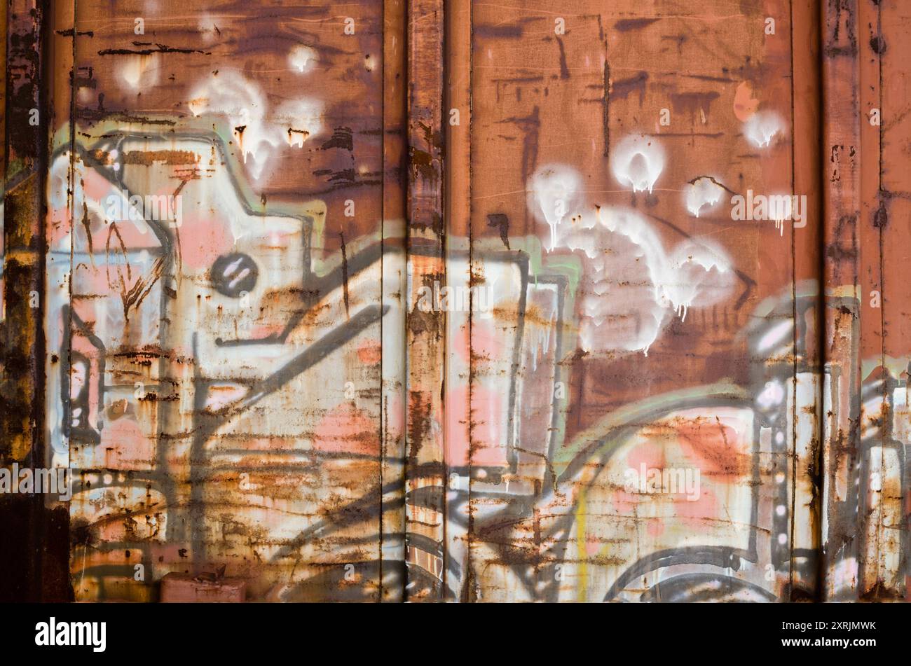 Old, abandoned and rusty railroad car, covered in graffiti. Bold, colorful shapes and abstract ...