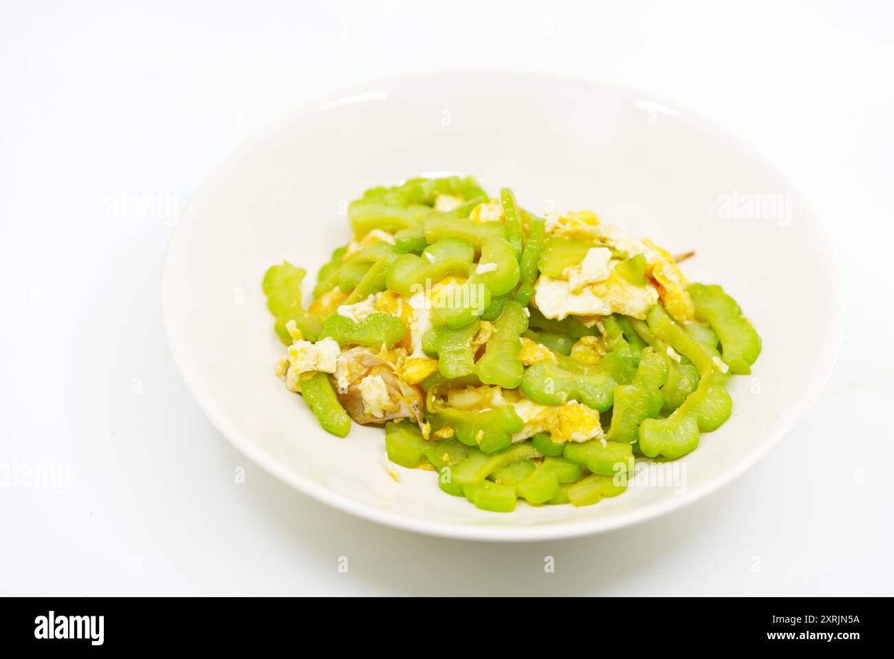 Close up food image of stir-fried bitter melon with chicken egg and ...