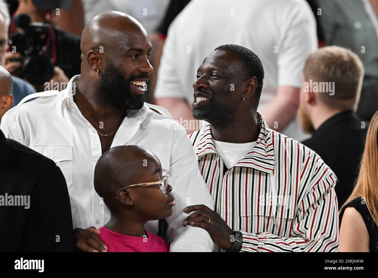 Teddy Riner and Omar Sy attend the Men's Basketball Final Gold Medal ...