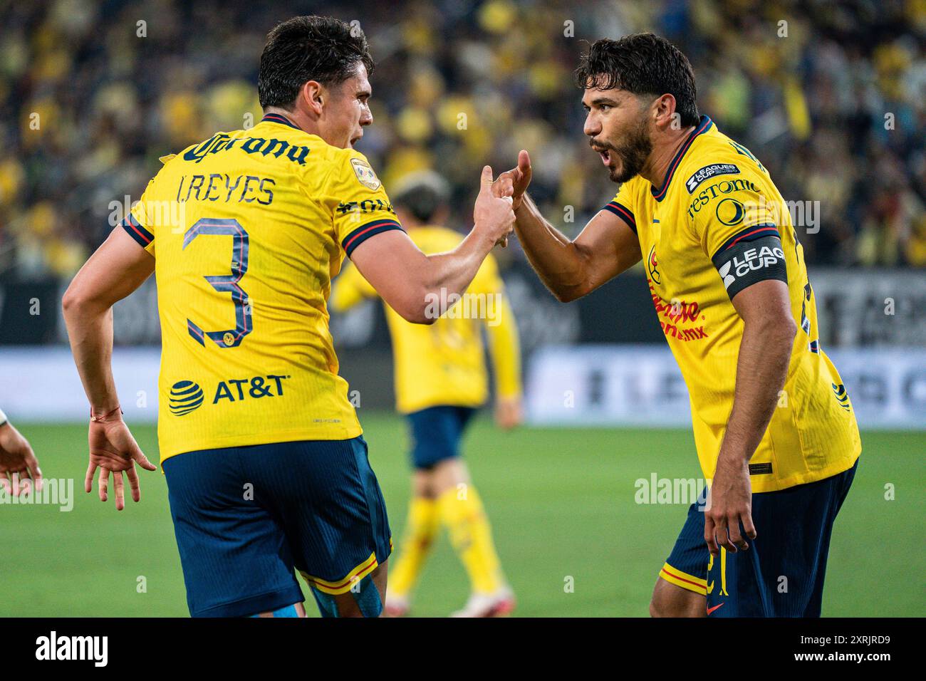América forward Henry Martín (21) celebrates with defender Israel Reyes ...
