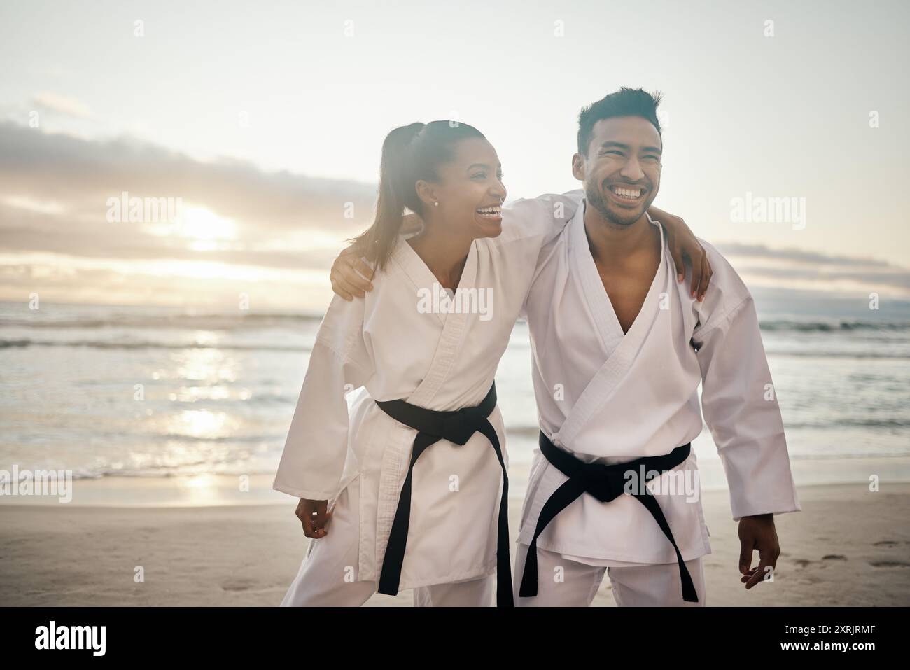Happy people, friends and karate with hug on beach for martial arts ...