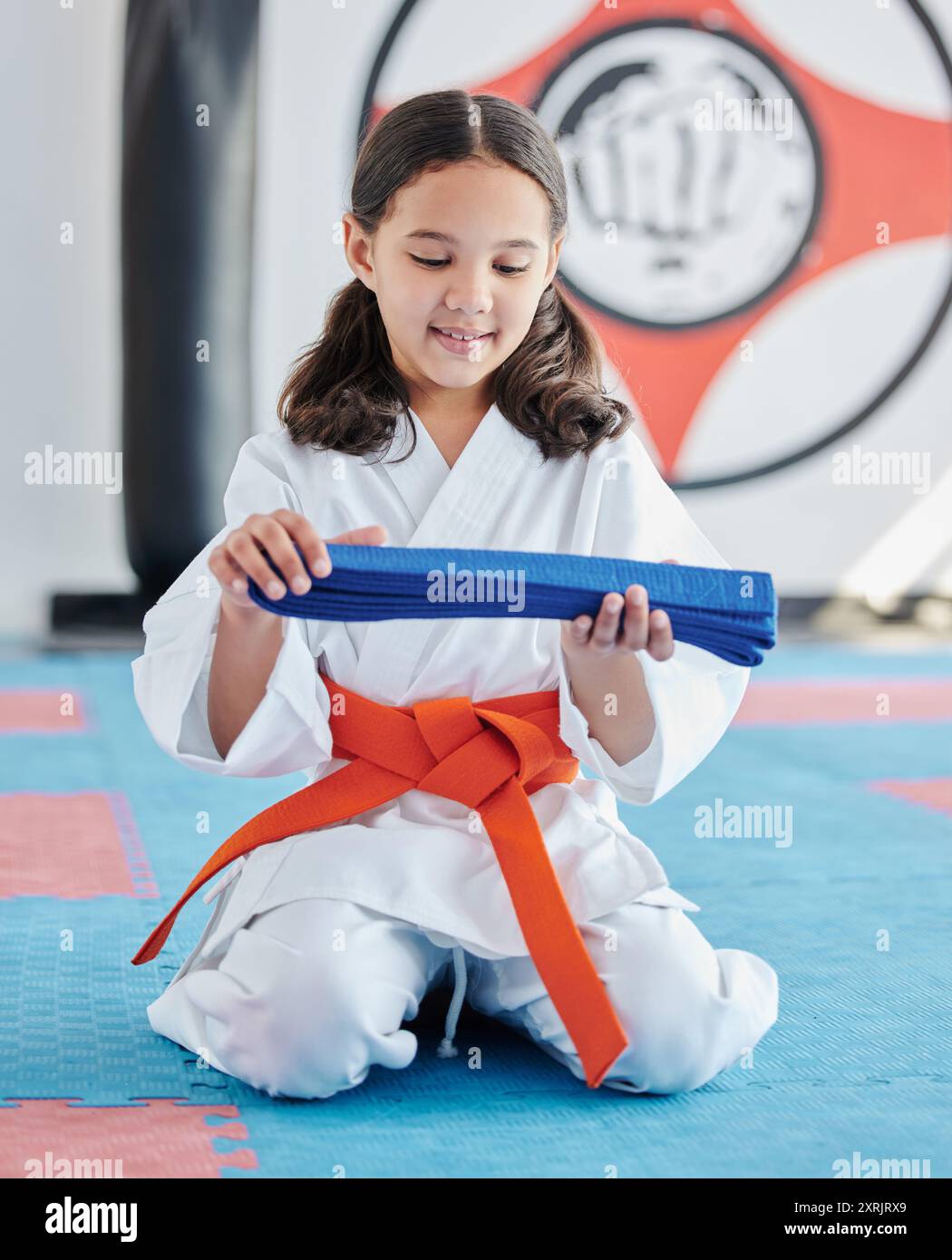 Martial arts, belt and girl in studio for fitness, training and fight ...