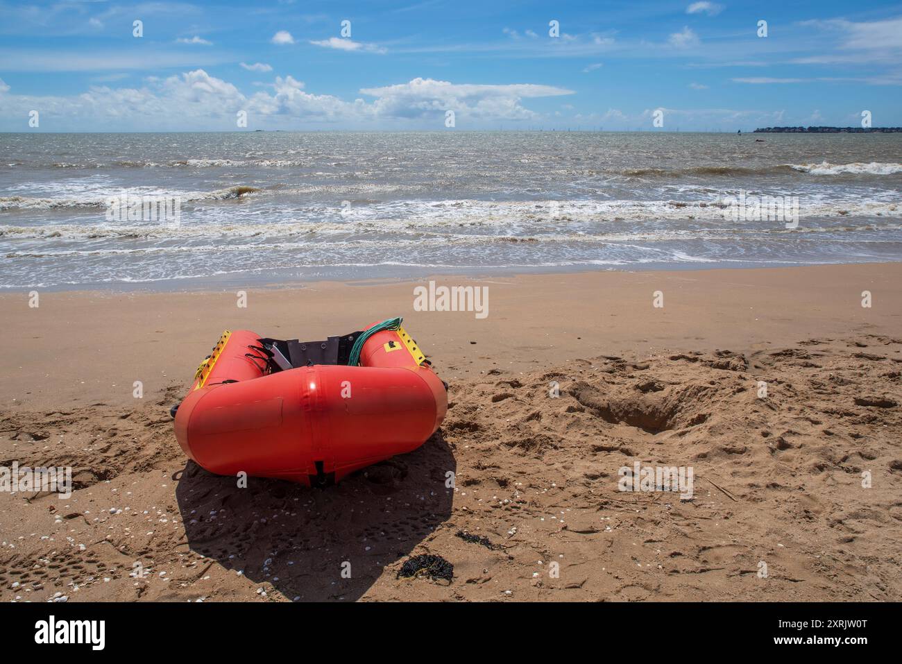 Red inflatable boat on a beach in Brittany in summer in France Stock ...