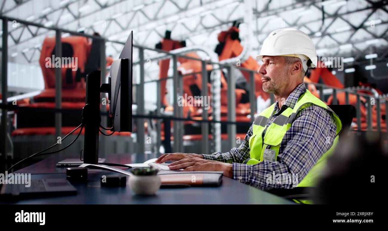 Engineer Using PC In Car Factory Automated Assembly Line Stock Photo ...