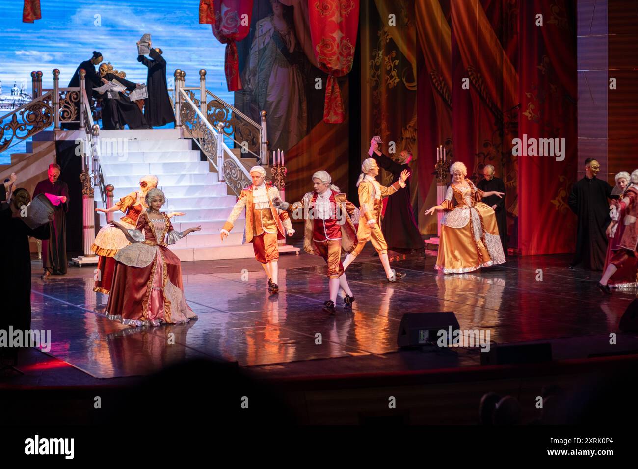 Actresses and actors acting and singing in the musical Stock Photo - Alamy