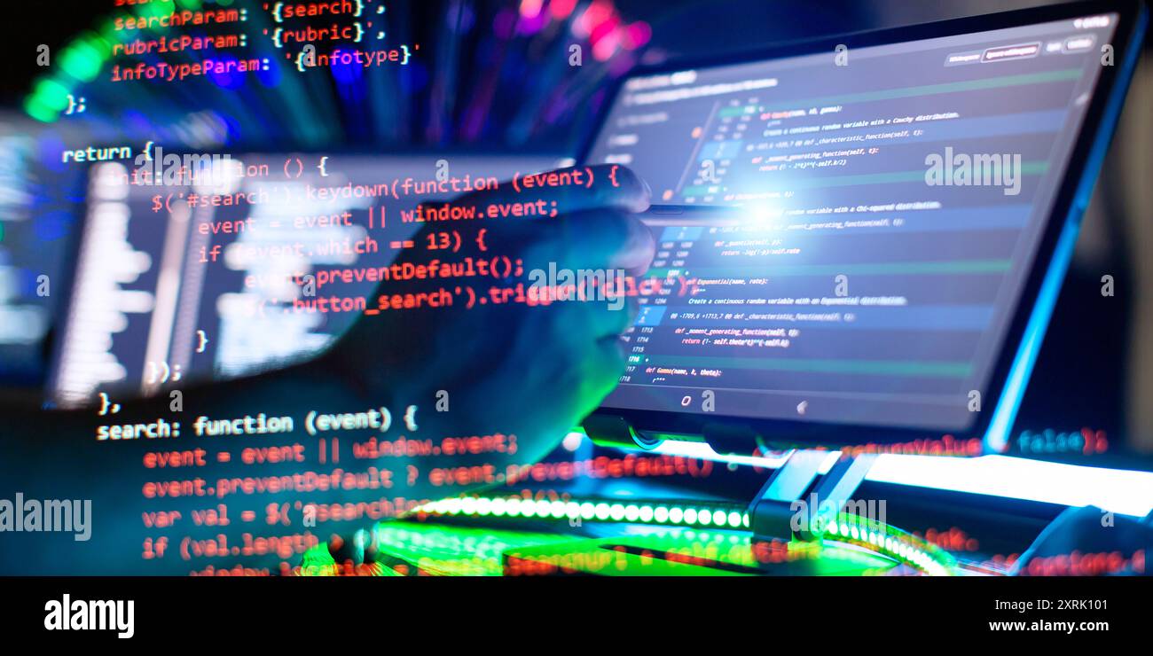 Program code on a computer monitor with fiber optic background ...