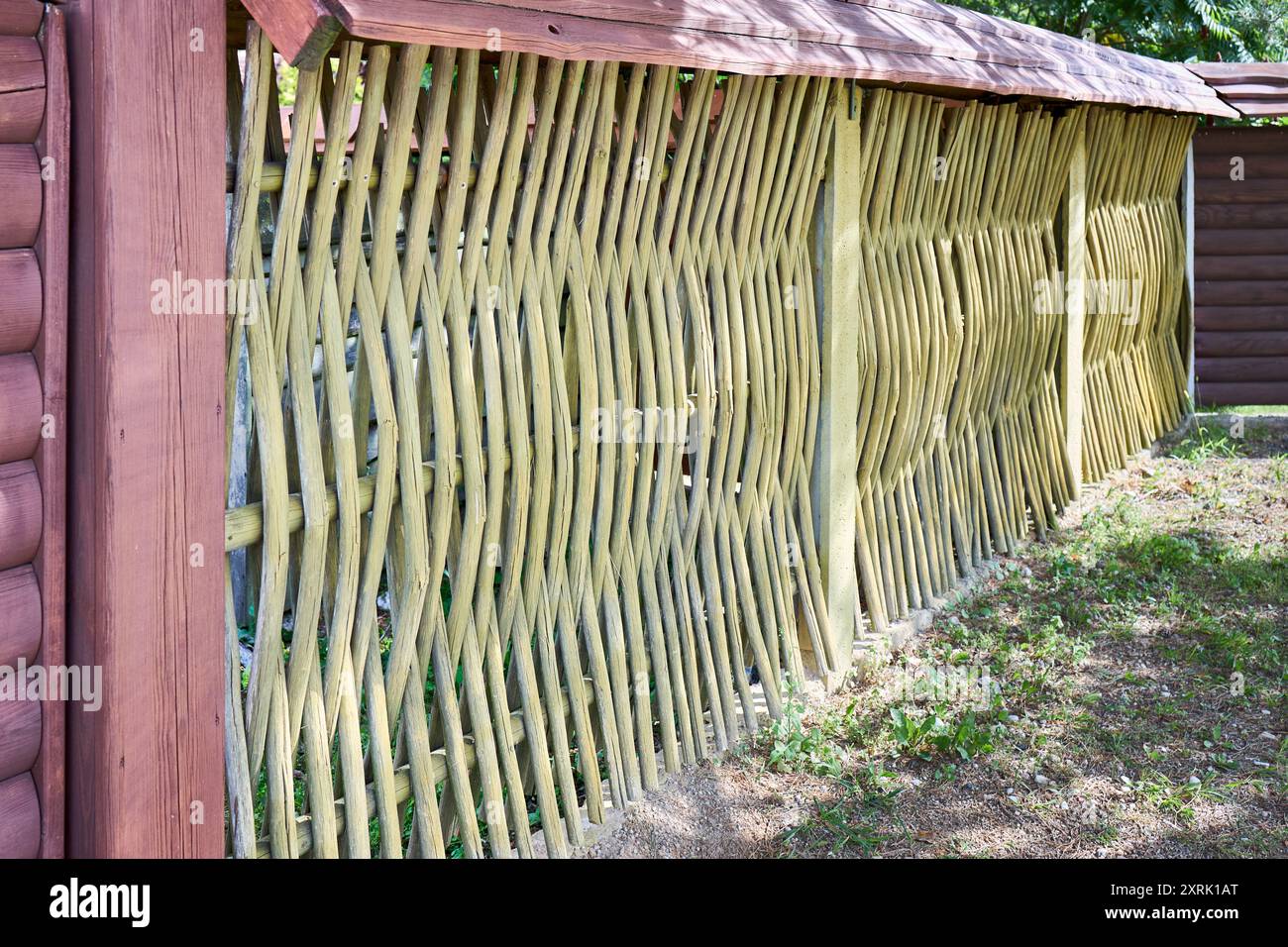 Fence wicker made of hazel rods. Organic woven hazel wicker fence rural ...