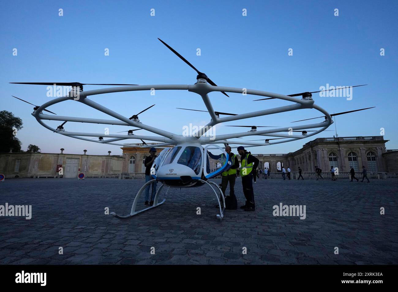 People gather at a Volocopter aircraft before a test flight on the last ...