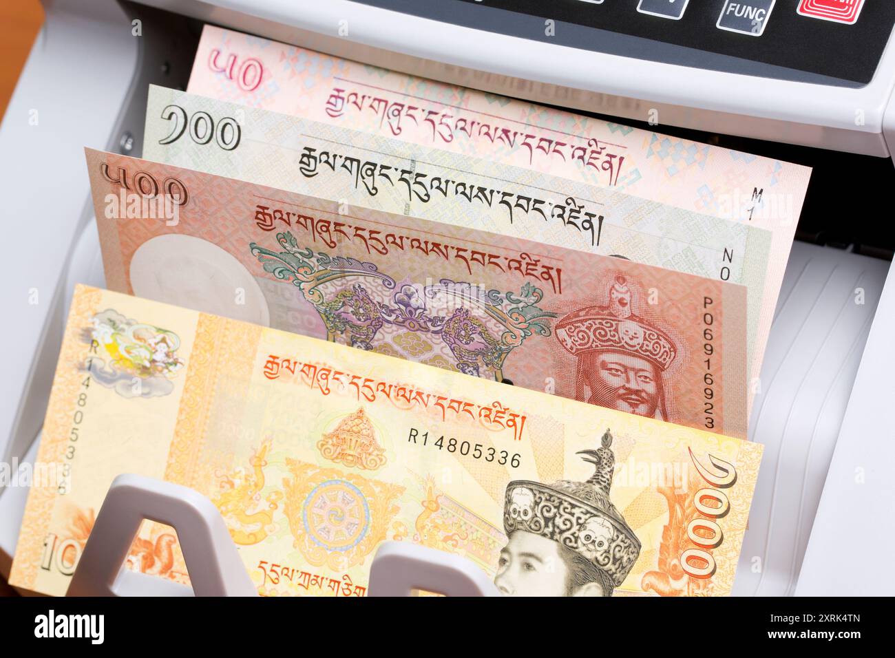 Bhutanese money - ngultrum in the counting machine Stock Photo - Alamy