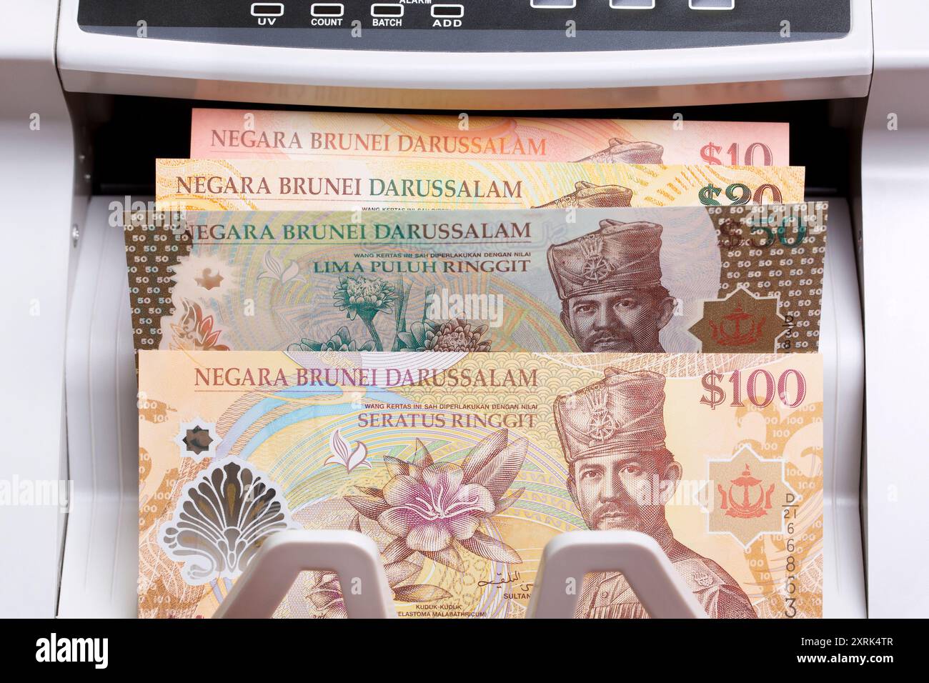 Brunei money - dollar in the counting machine Stock Photo - Alamy