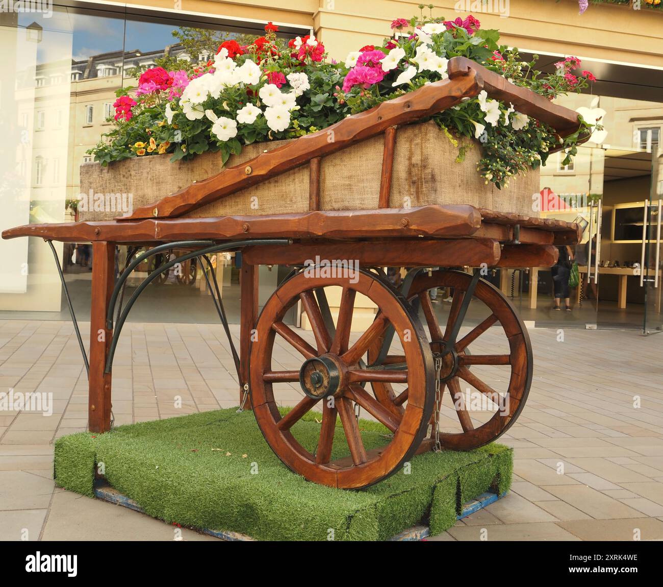 Decorative reproduction wooden handcart or barrow with flower display ...