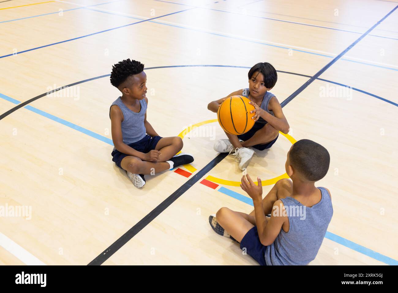 Children sitting together in gymnasium hi-res stock photography and ...