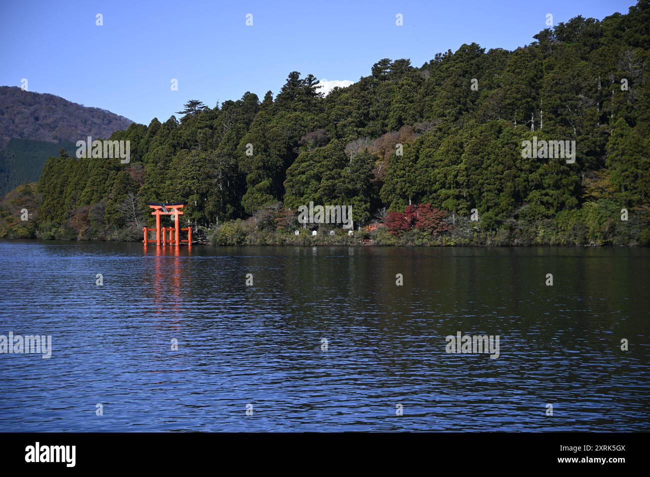 Landscape with scenic view of Hakone-jinja shrine red torii gate a ...
