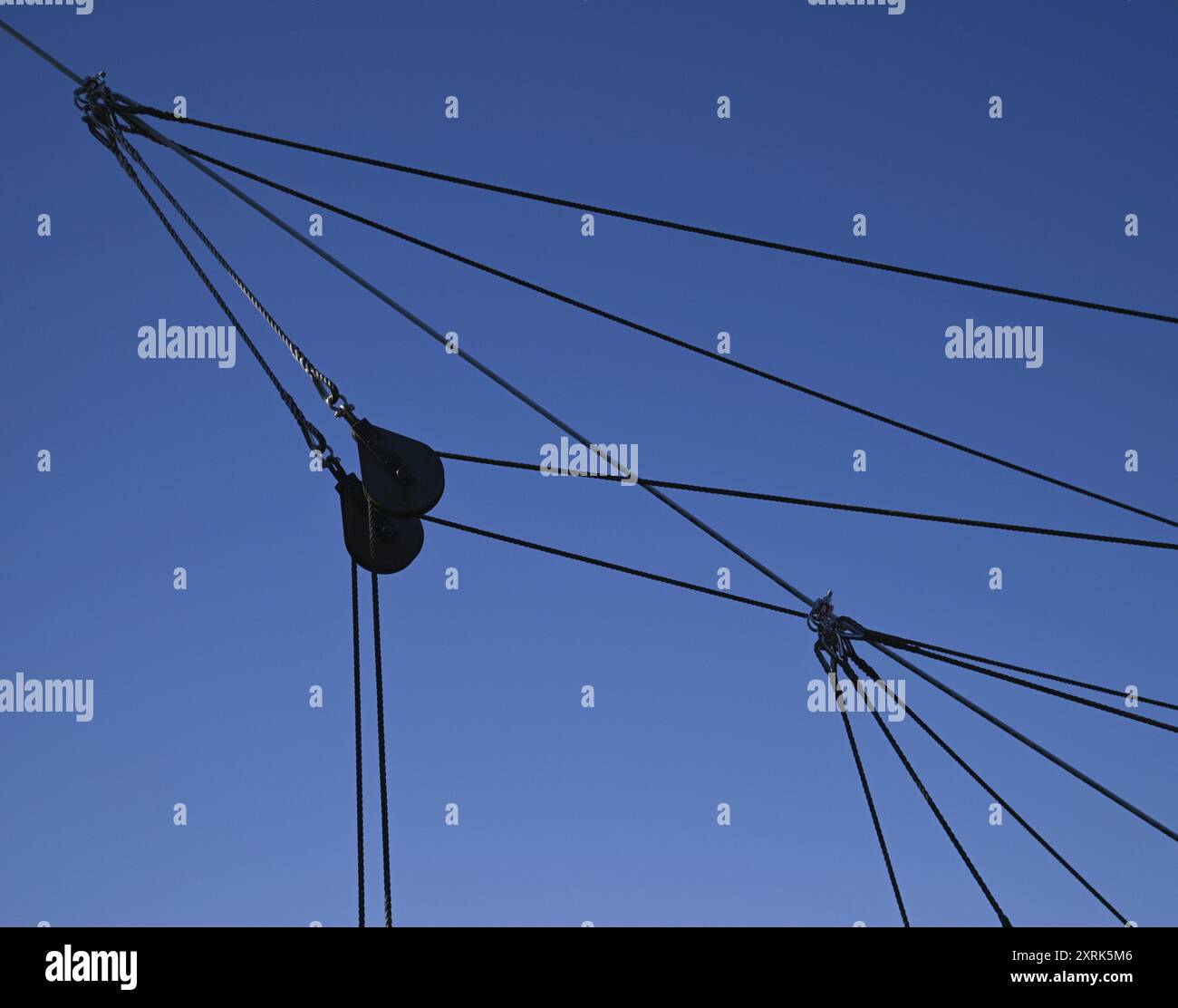Antique pirate ship rope and pulley against a blue sky in Ashinoko lake ...
