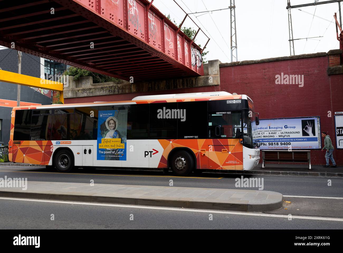 Side view of CDC Melbourne operated bus, featuring PTV livery, parked ...