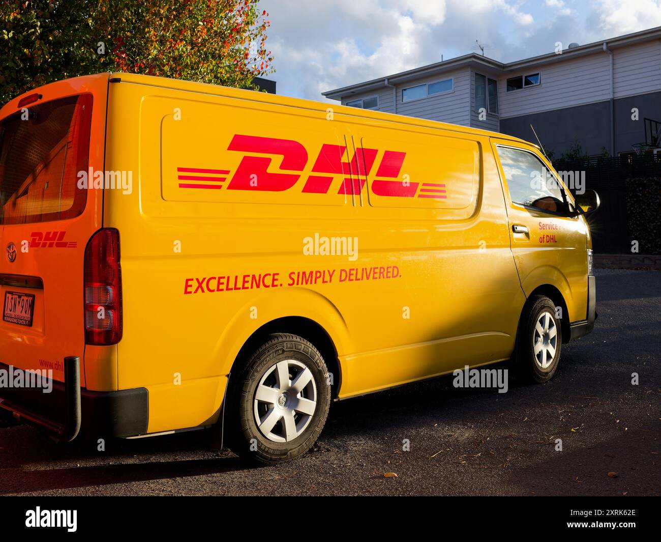 Yellow dhl delivery van parked hi-res stock photography and images - Alamy