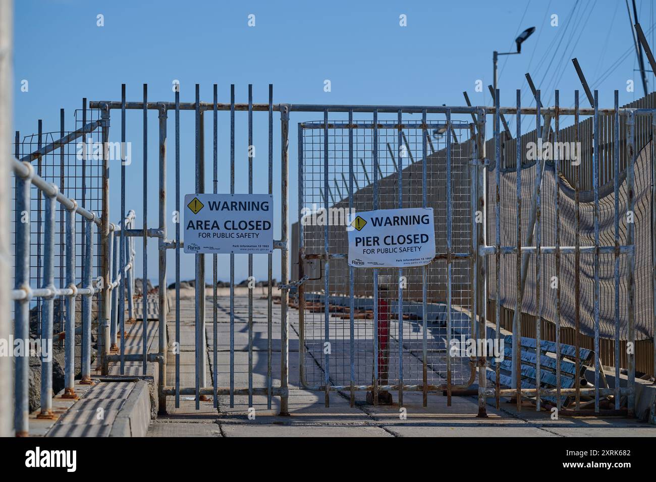 Locked rusting metal gate at Middle Brighton Pier, featuring Parks ...