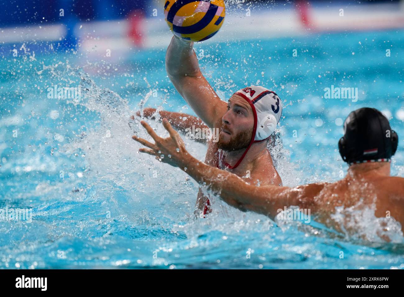 Hungary's Marton Vamos, right, tries to block United States' Marko ...
