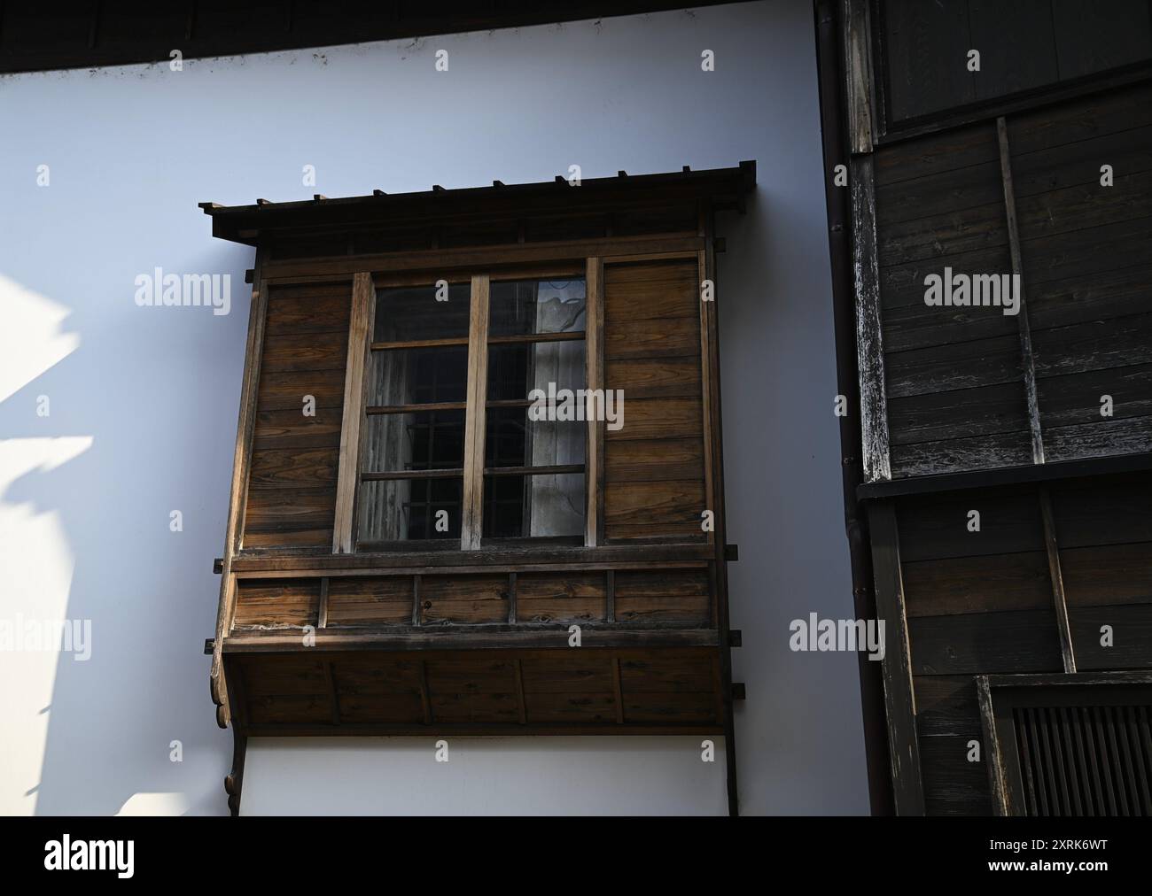 Edo period wooden window on the facade of a local house in Kanazawa ...