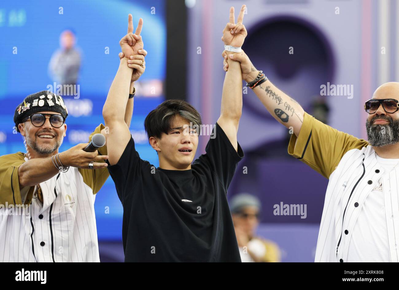 Japan's Hiroto Ono (C), known as Hiro10, acknowledges the crowd after finishing the men's ...