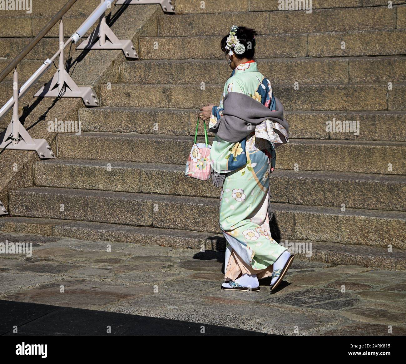Geisha with the traditional yukata costume on the grounds of the ...