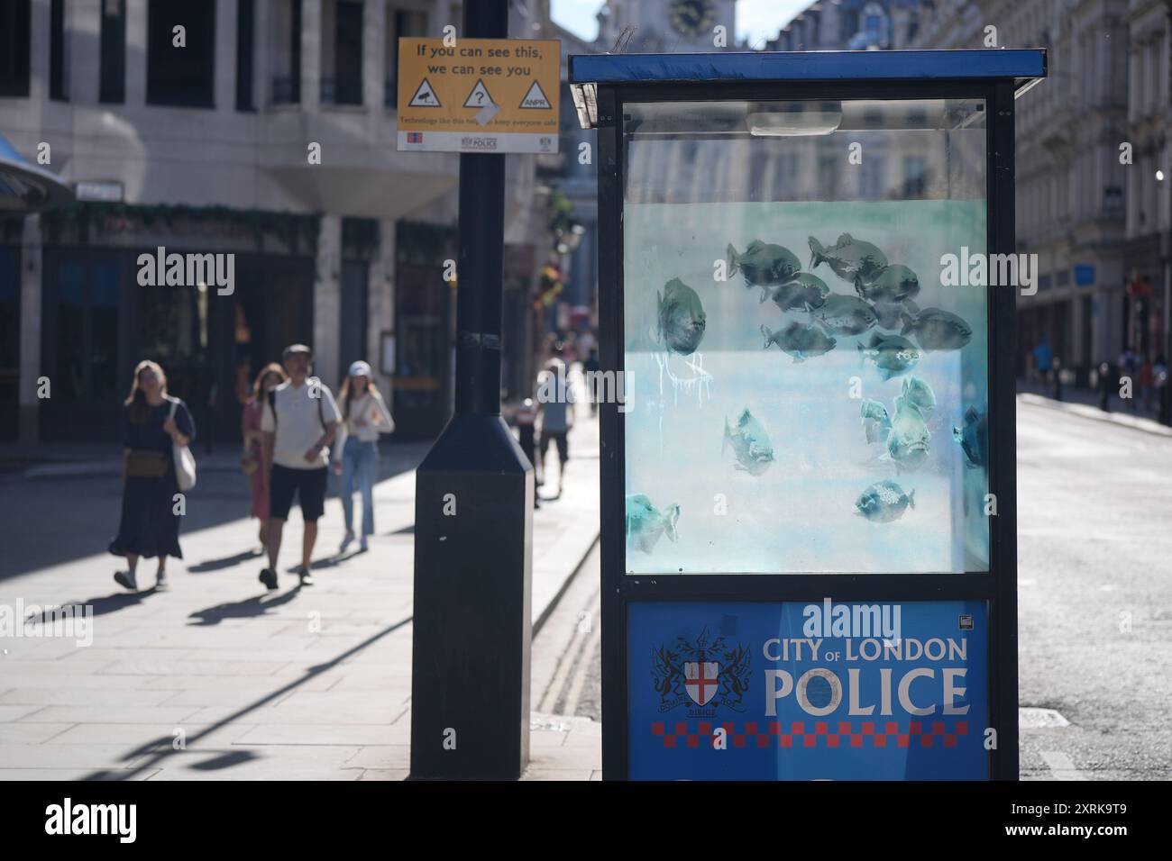 A new design of swimming fish has appeared on a police box in the City ...