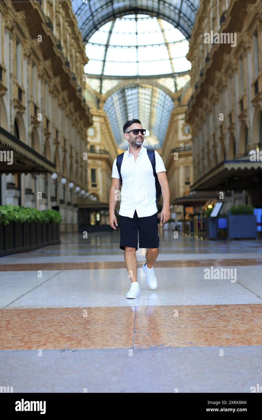 A Young Man Dressed in a Stylish and Trendy Outfit Stands Proudly in a ...