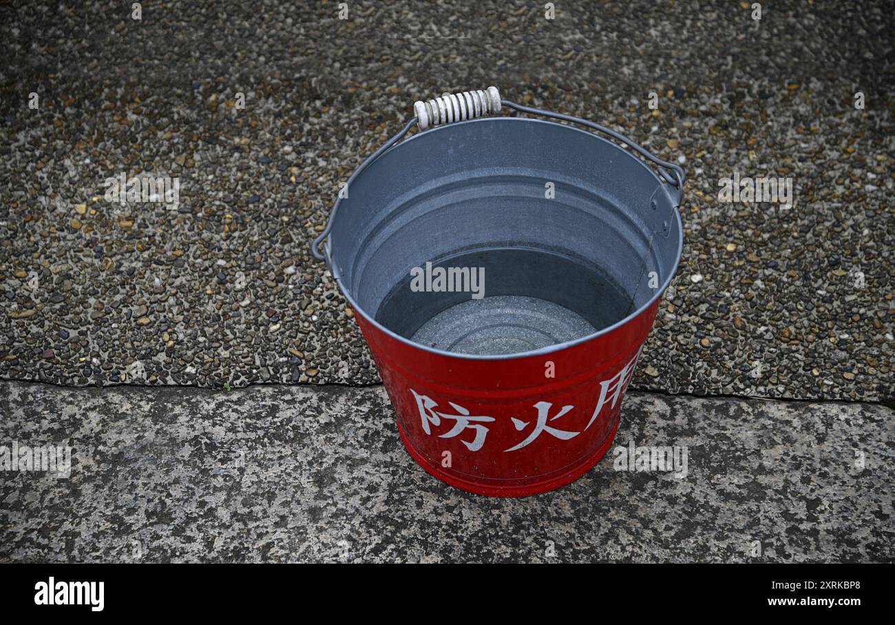 Traditional Japanese red galvanized iron fire prevention bucket in Nara ...