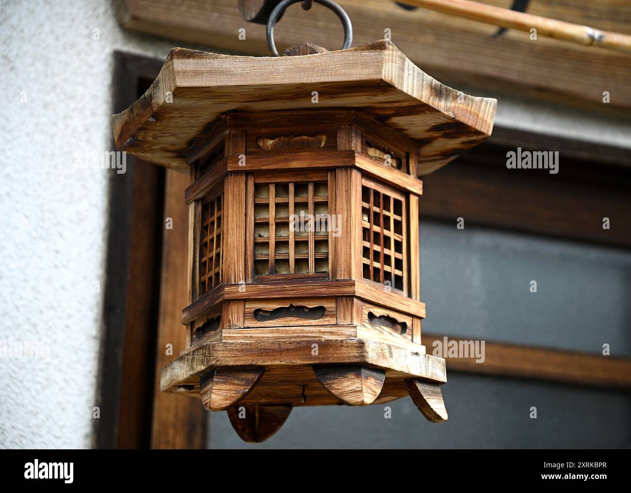 Traditional Japanese wooden Tōrō lantern on the exterior of a rural ...