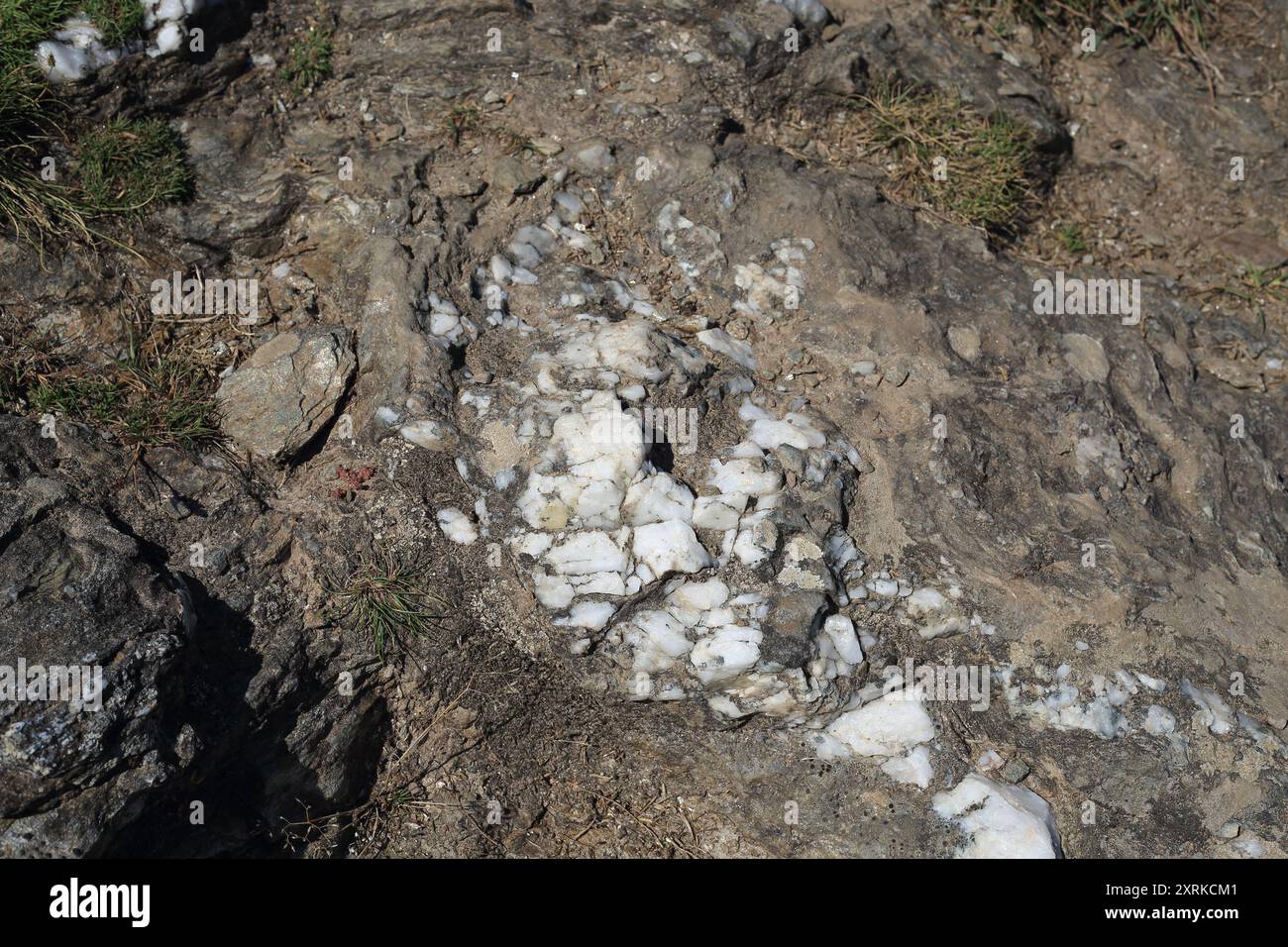 Exposed rock close to coastal footpath (GR340) at Deuborh, Belle Ile en ...