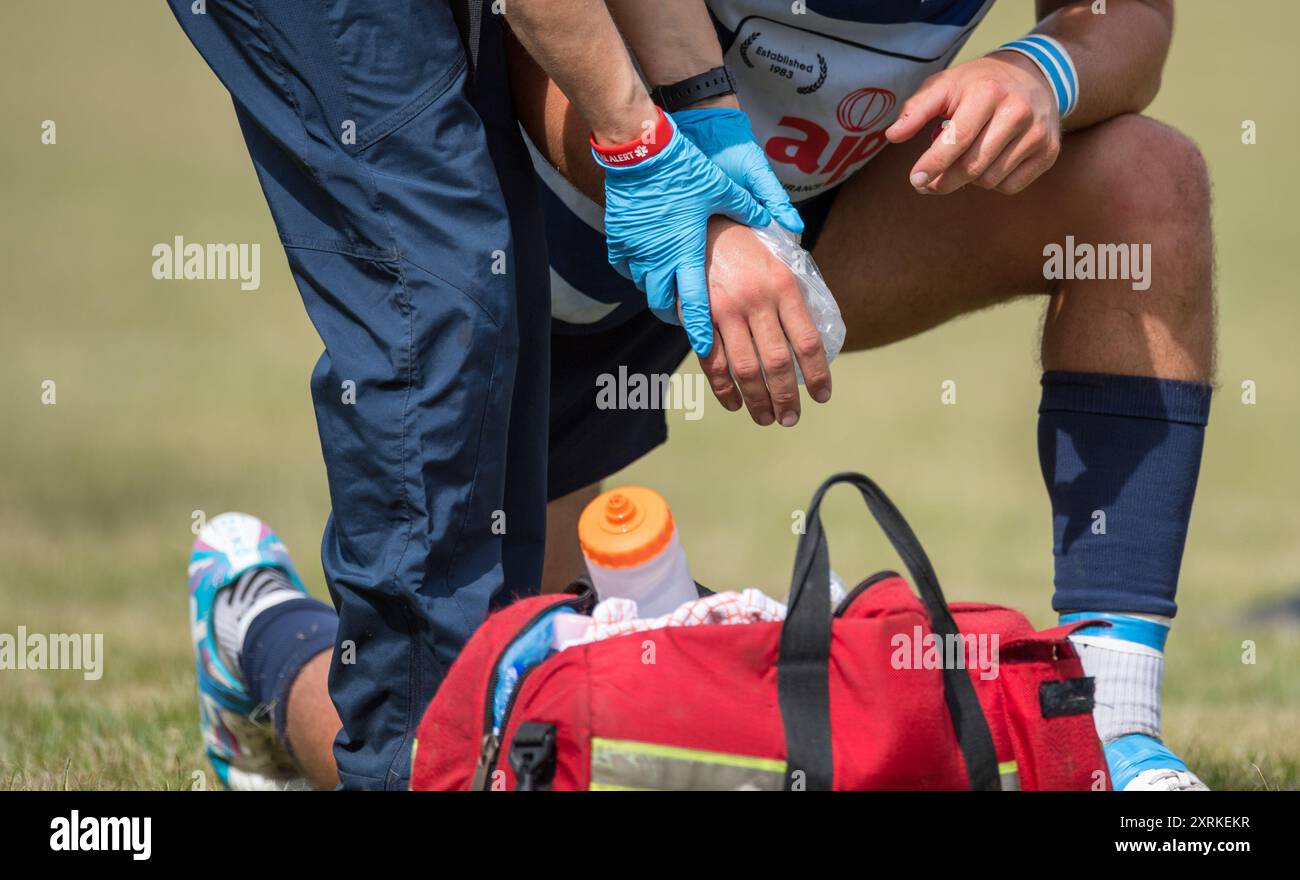 English amateur Rugby Union player recieving first aid treatment whilst ...
