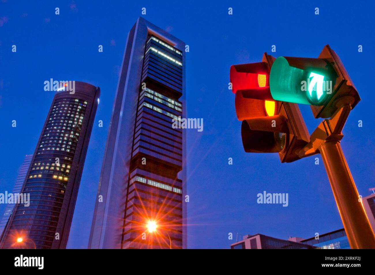Traffic light and Four Towers, night view. Madrid, Spain Stock Photo ...