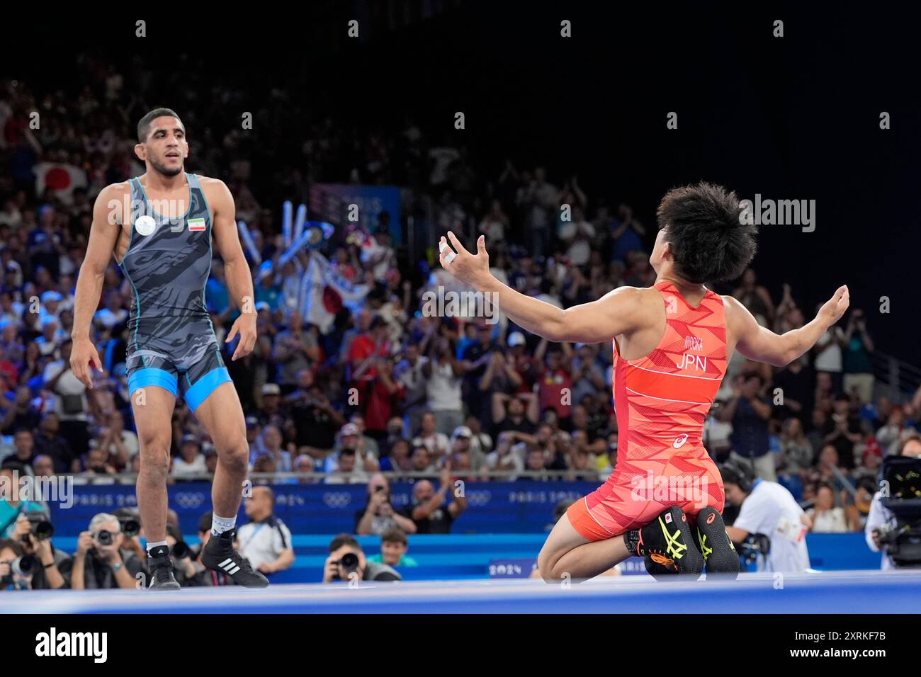 Japan's Kotaro Kiyooka celebrates after defeating Iran's Rahman ...