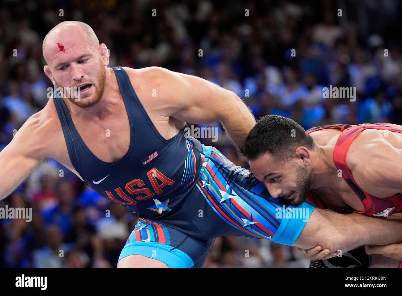 Iran's Amirali Azarpira, in red, and Kyle Frederick Snyder, of the ...