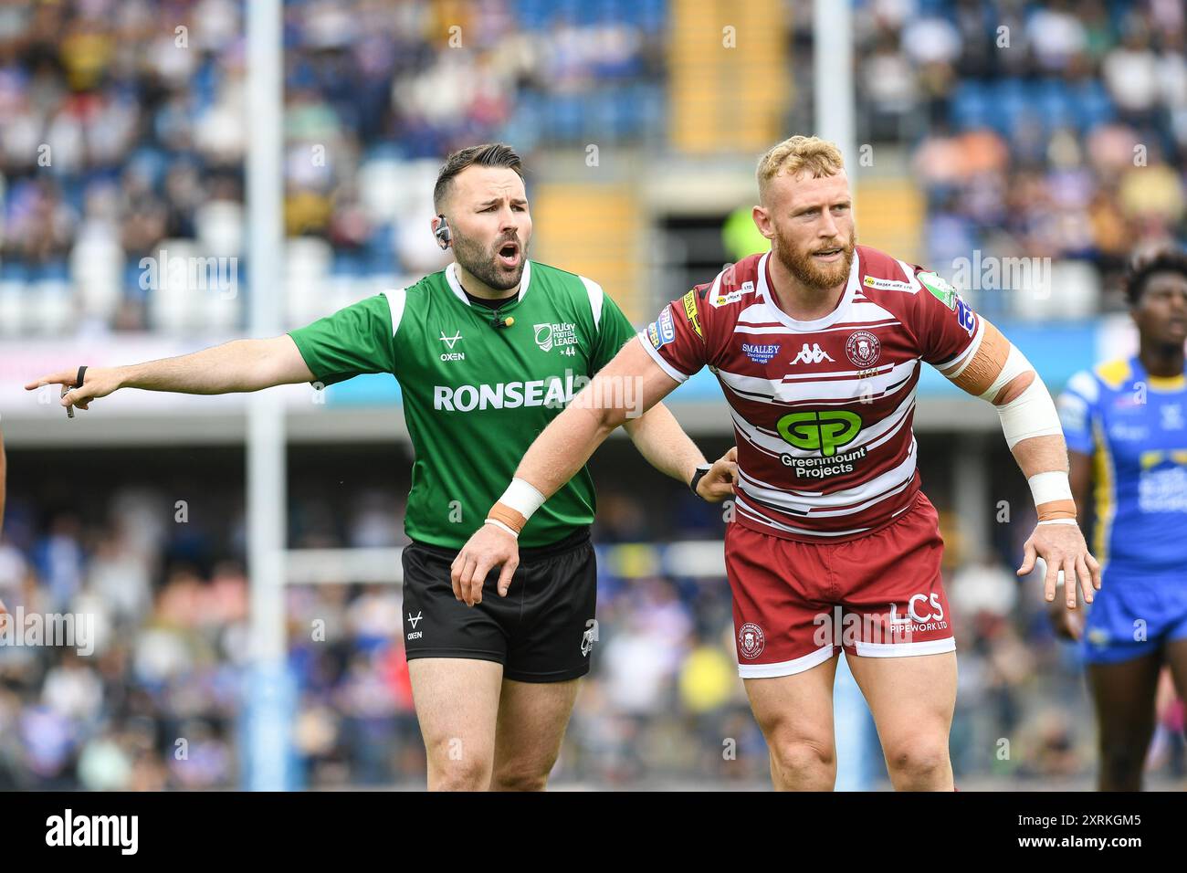 Leeds, England - 10th August 2024 - Referee Liam Moore and Luke ...