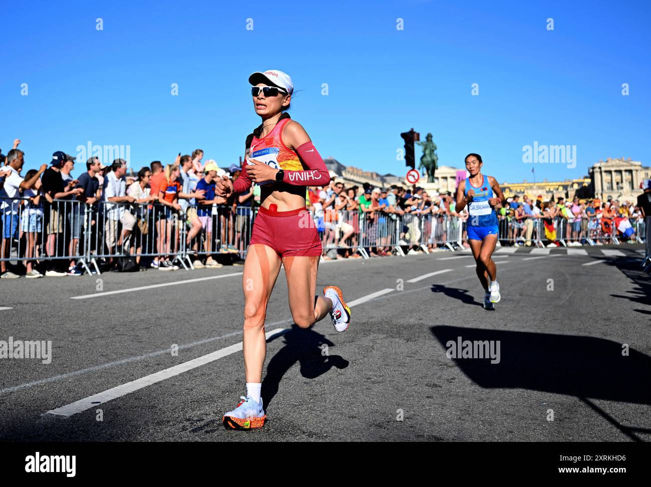 Zhang Deshun, front, of China competes during the women's marathon ...
