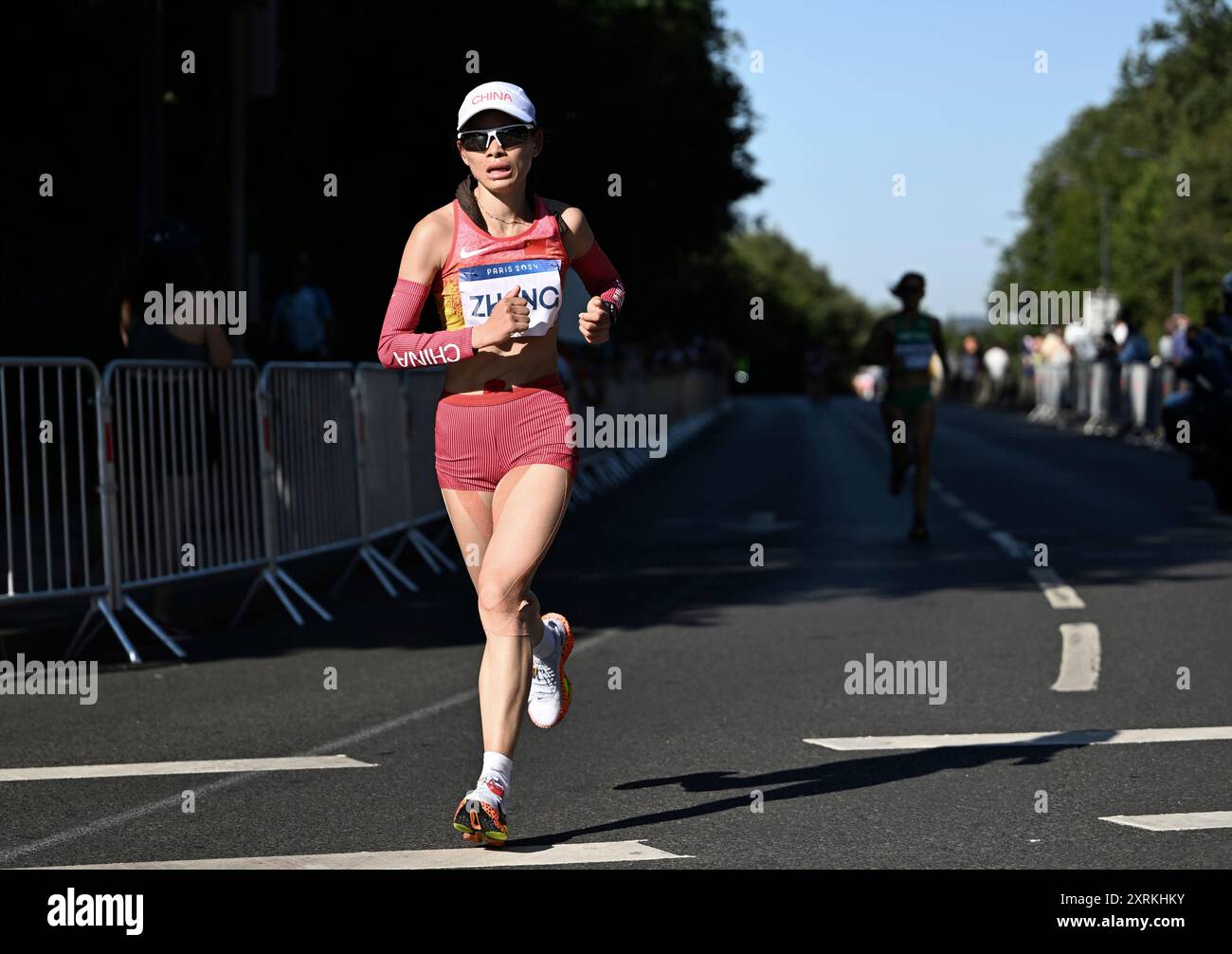 Zhang Deshun of China competes during the women's marathon competition ...