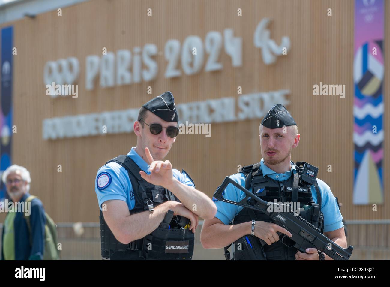 Police officers patrol near Boutique Official Store during Paris 2024 ...