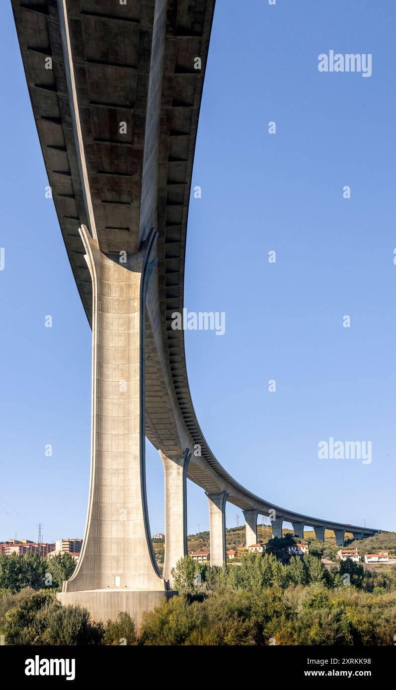 Reinforced concrete highway bridge seen from below, forming a curve and ...