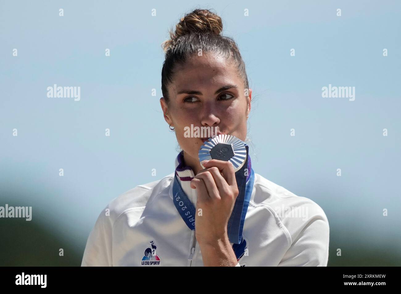 France's Elodie Clouvel kisses her silver medal on the podium after the ...