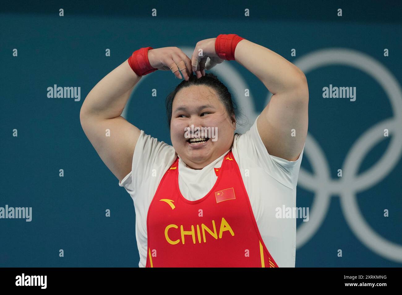 Li Wenwen of China celebrates after finishing in the first place to win ...