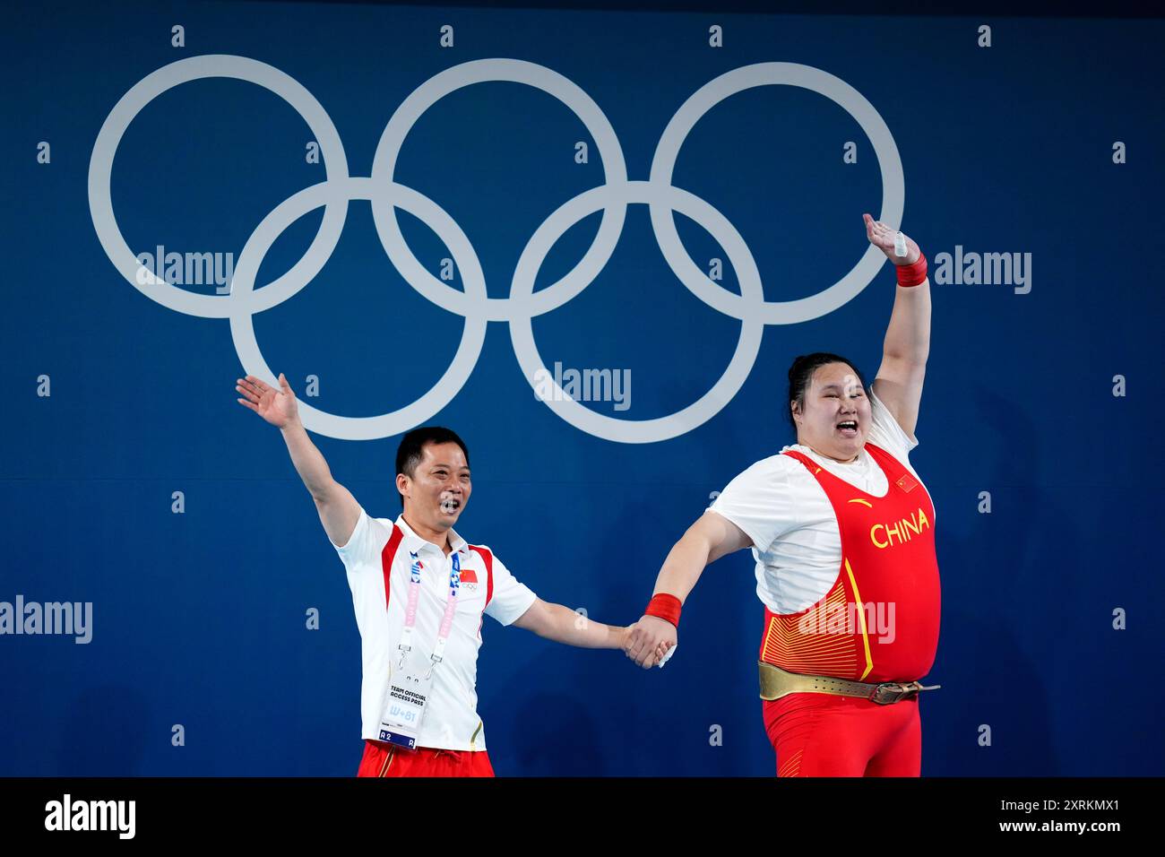 China's Li Wenwen (right) celebrates winning a gold medal following the ...