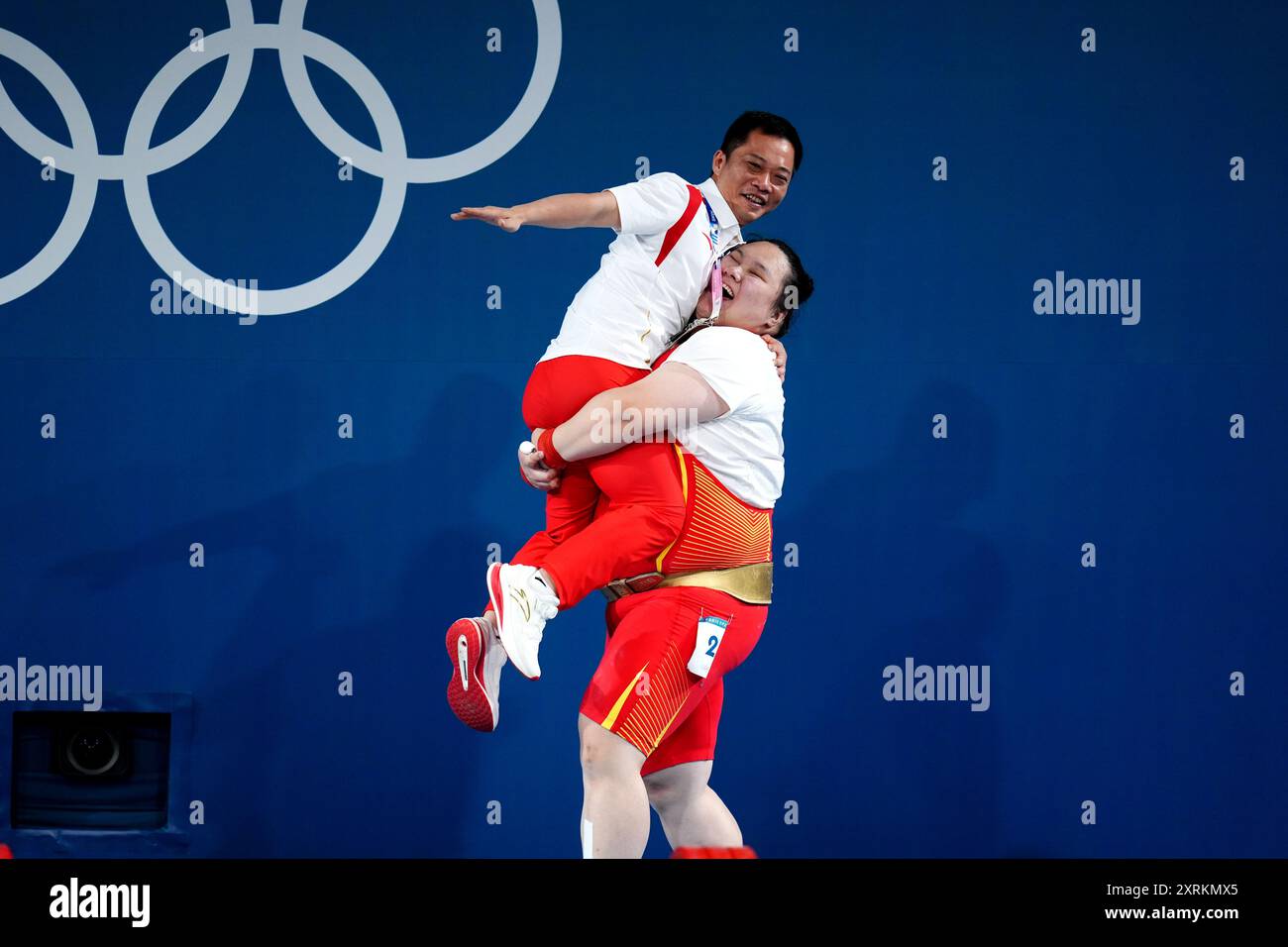 China's Li Wenwen (right) celebrates winning a gold medal following the ...
