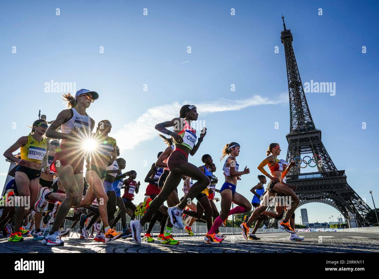 Paris, France. 11th Aug, 2024. Competitors run past the Eiffel Tower ...