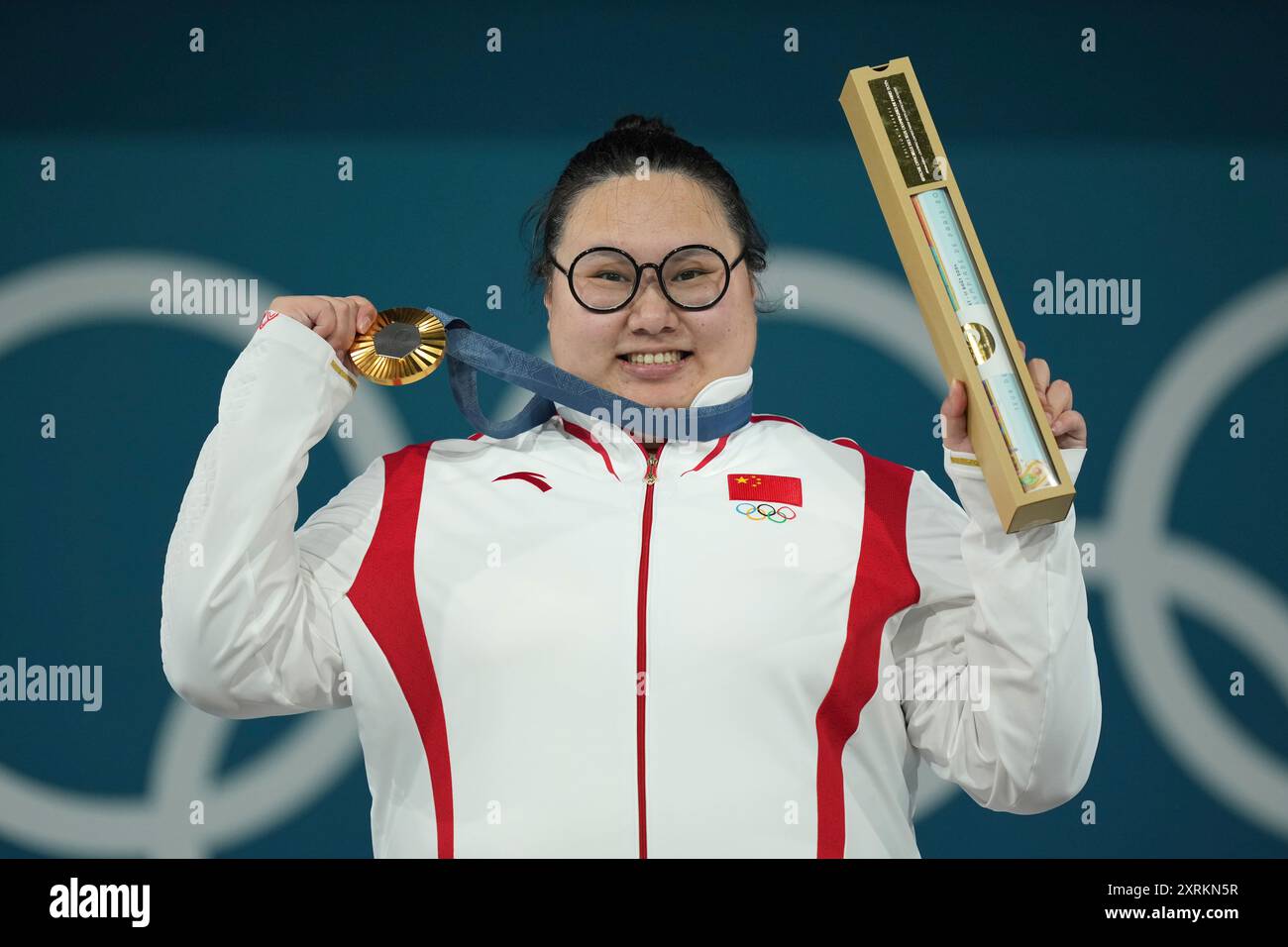 Gold medalist Li Wenwen of China celebrates on the podium during the ...
