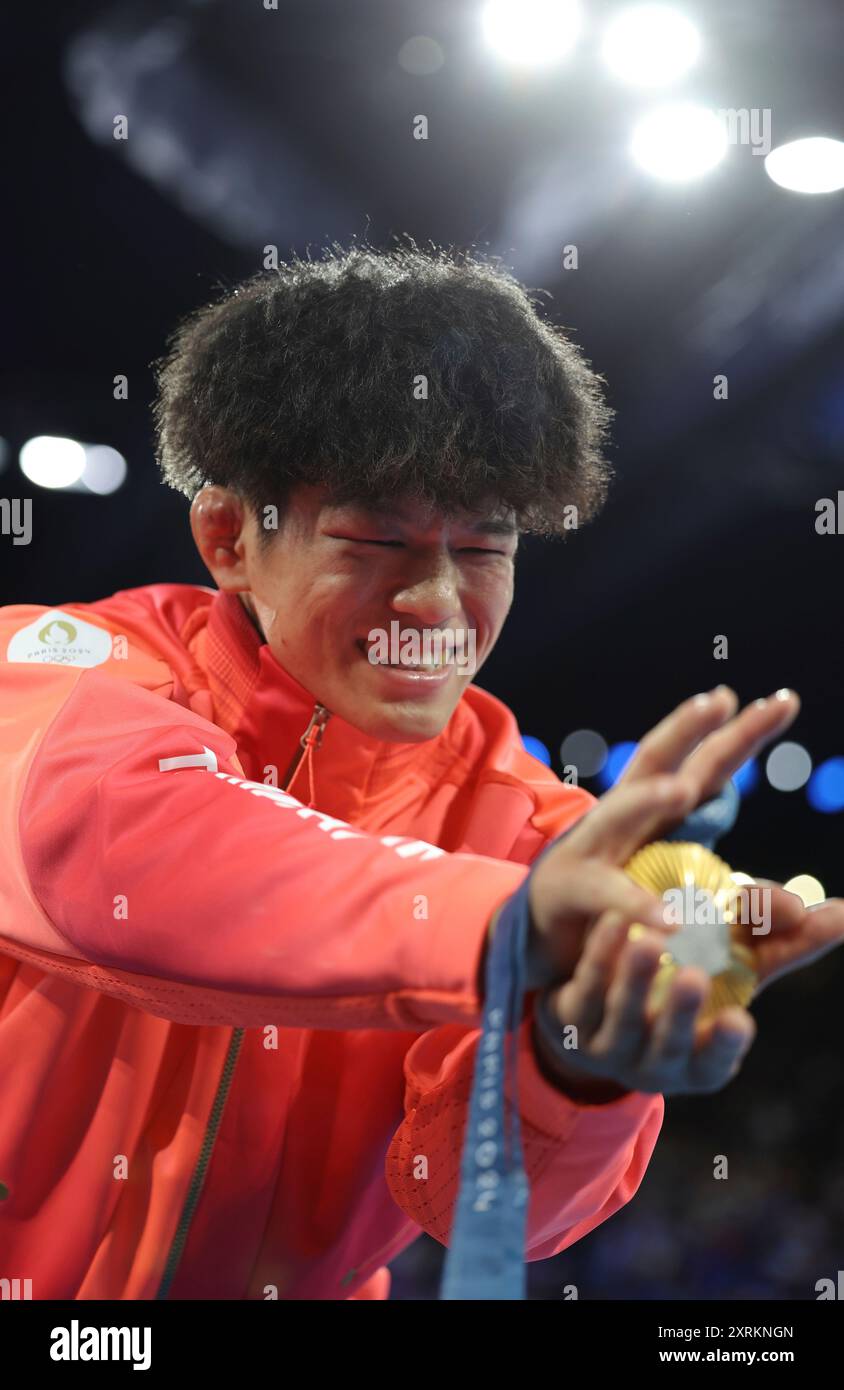 KIYOOKA Kotaro of Japan, the gold medalist, poses for cameras during a ...