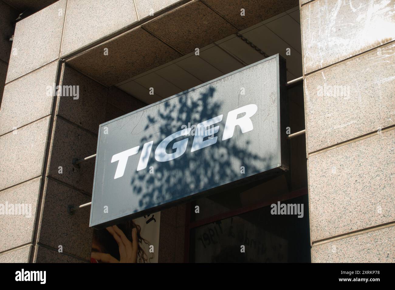 Tiger shop logo in a facade of a building Stock Photo - Alamy