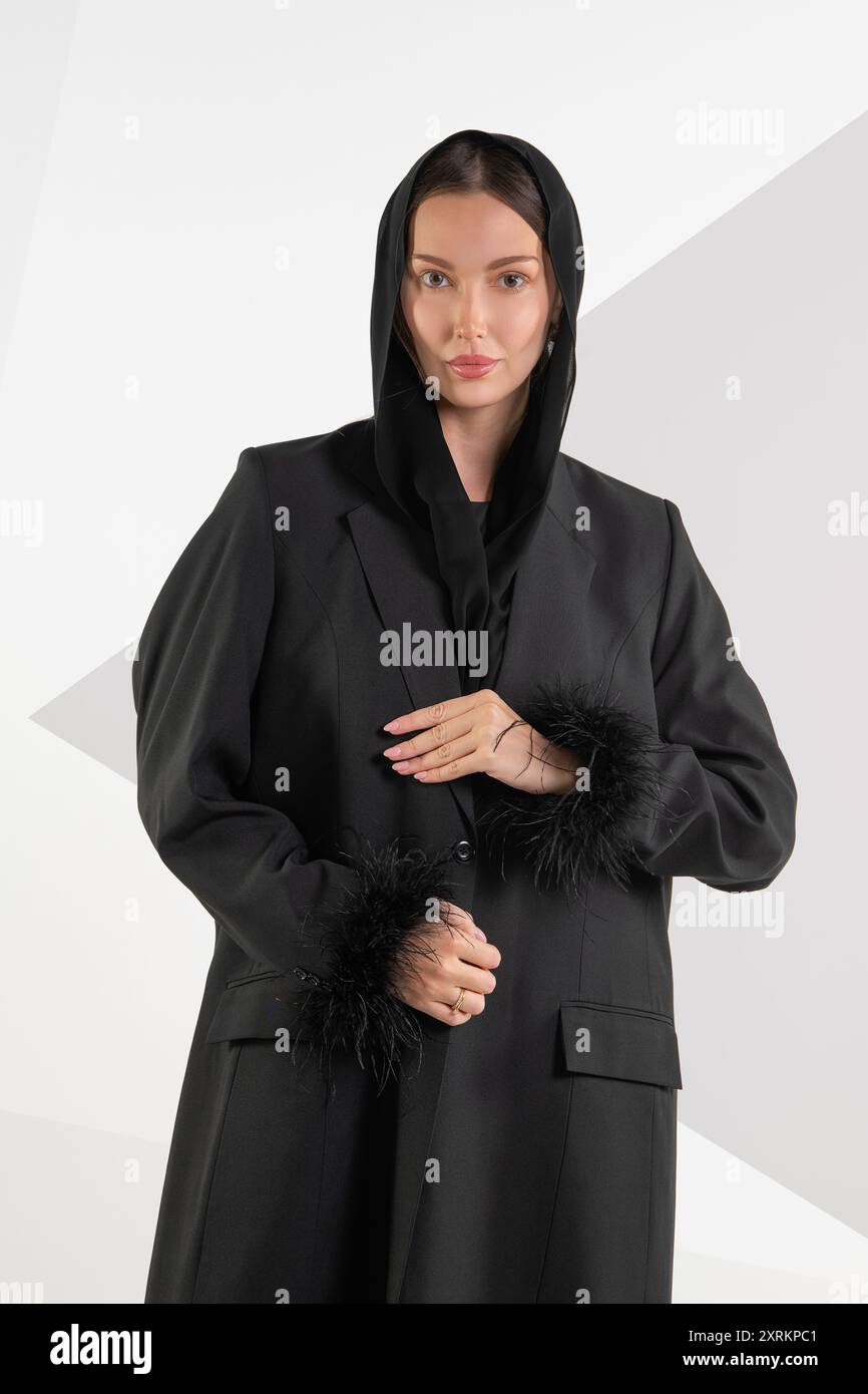 Asian Model poses for Arabic designer Abaya on isolated background ...