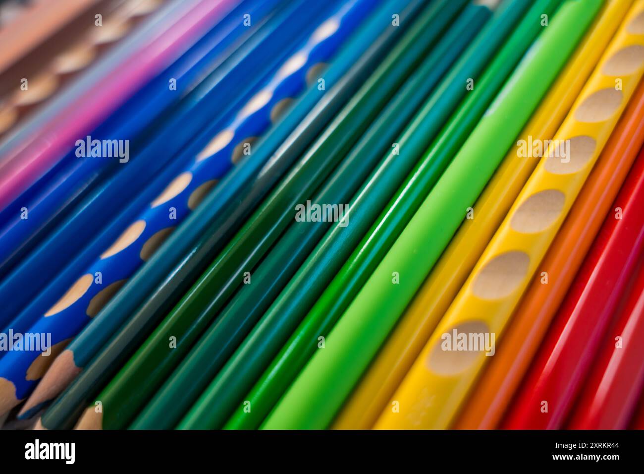 Vibrant colored pencils perfectly aligned for a creative challenge ...