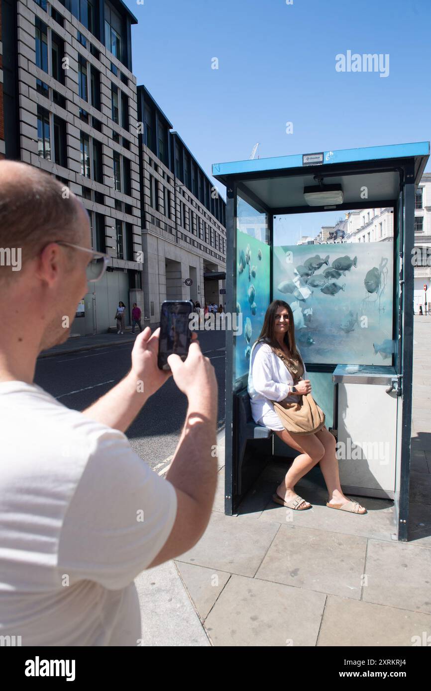 London, UK. 11th Aug, 2024. People take photos of Street Artist Banksy ...